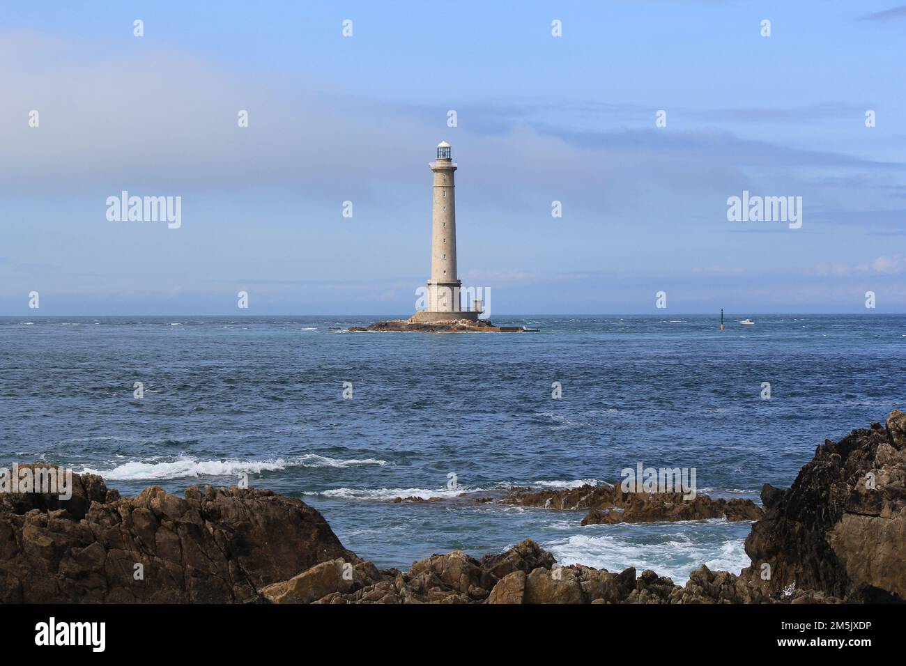 the lighthouse of cap de la hague in the blue sea in normandy at the ...