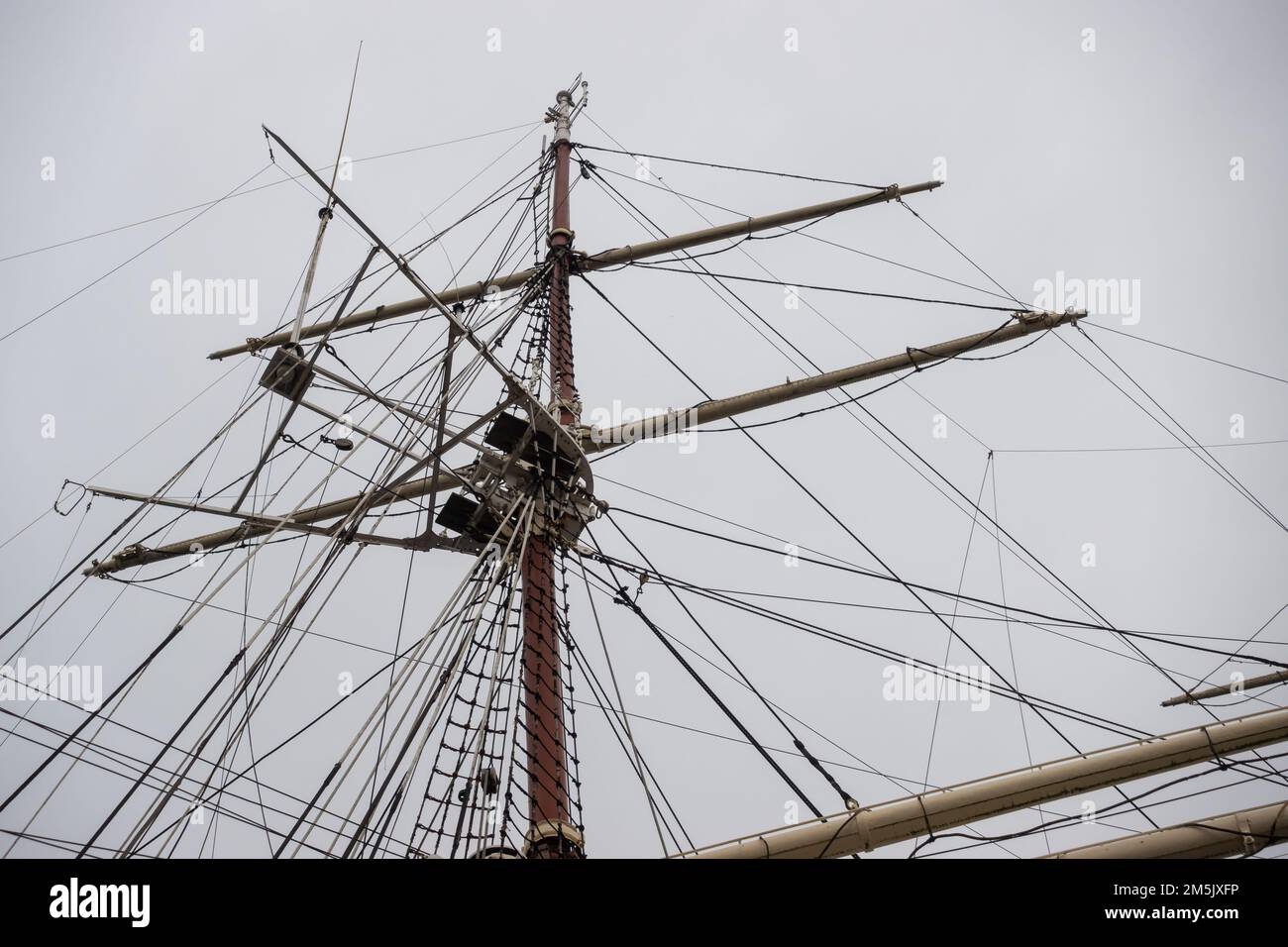 Rigging masts on a deep-sea sailing ship. The mast photographed against ...
