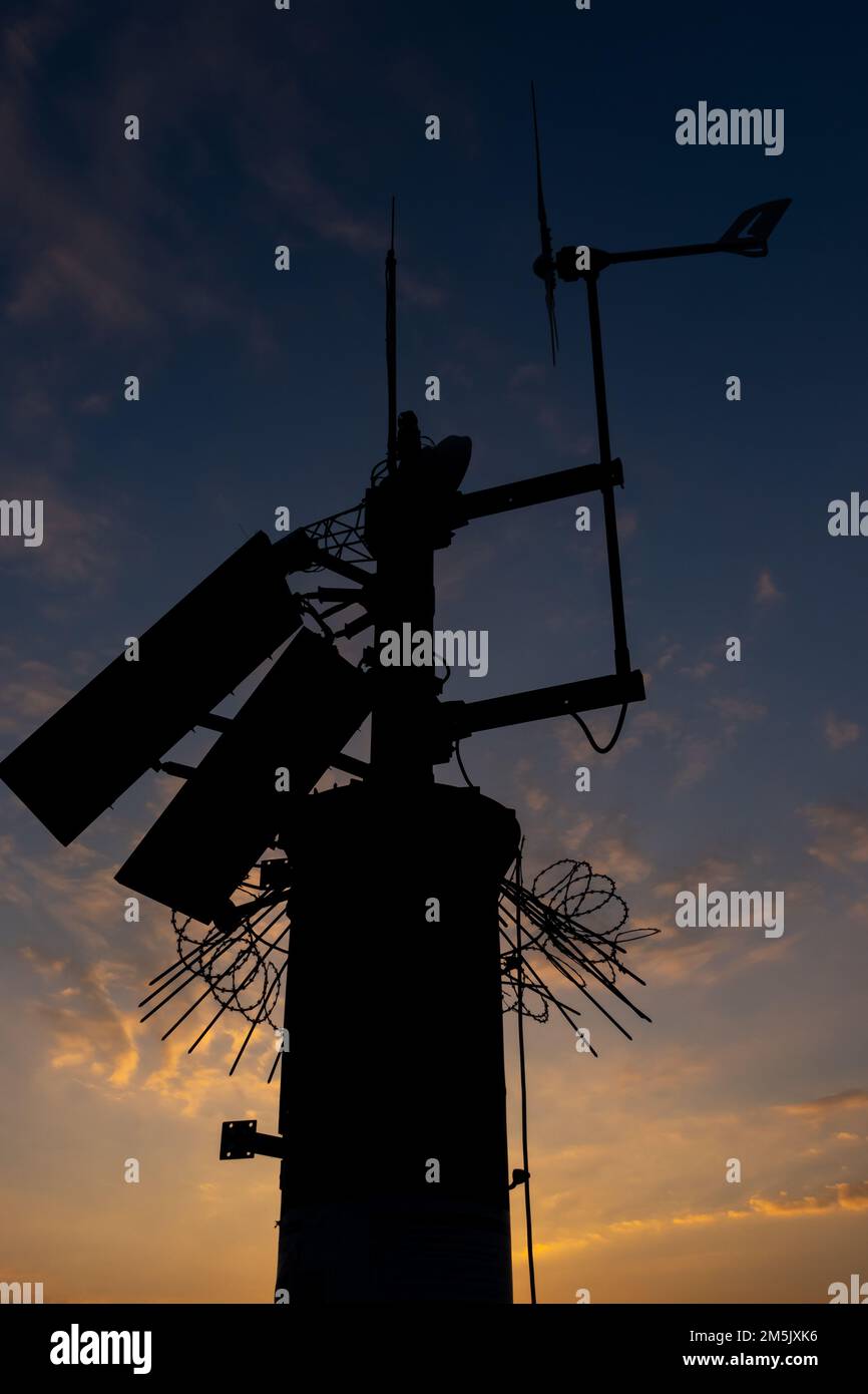 Meteo station against the setting sun. Elements of the continuous ... Meteo station against the setting sun. Elements of the continuous ...