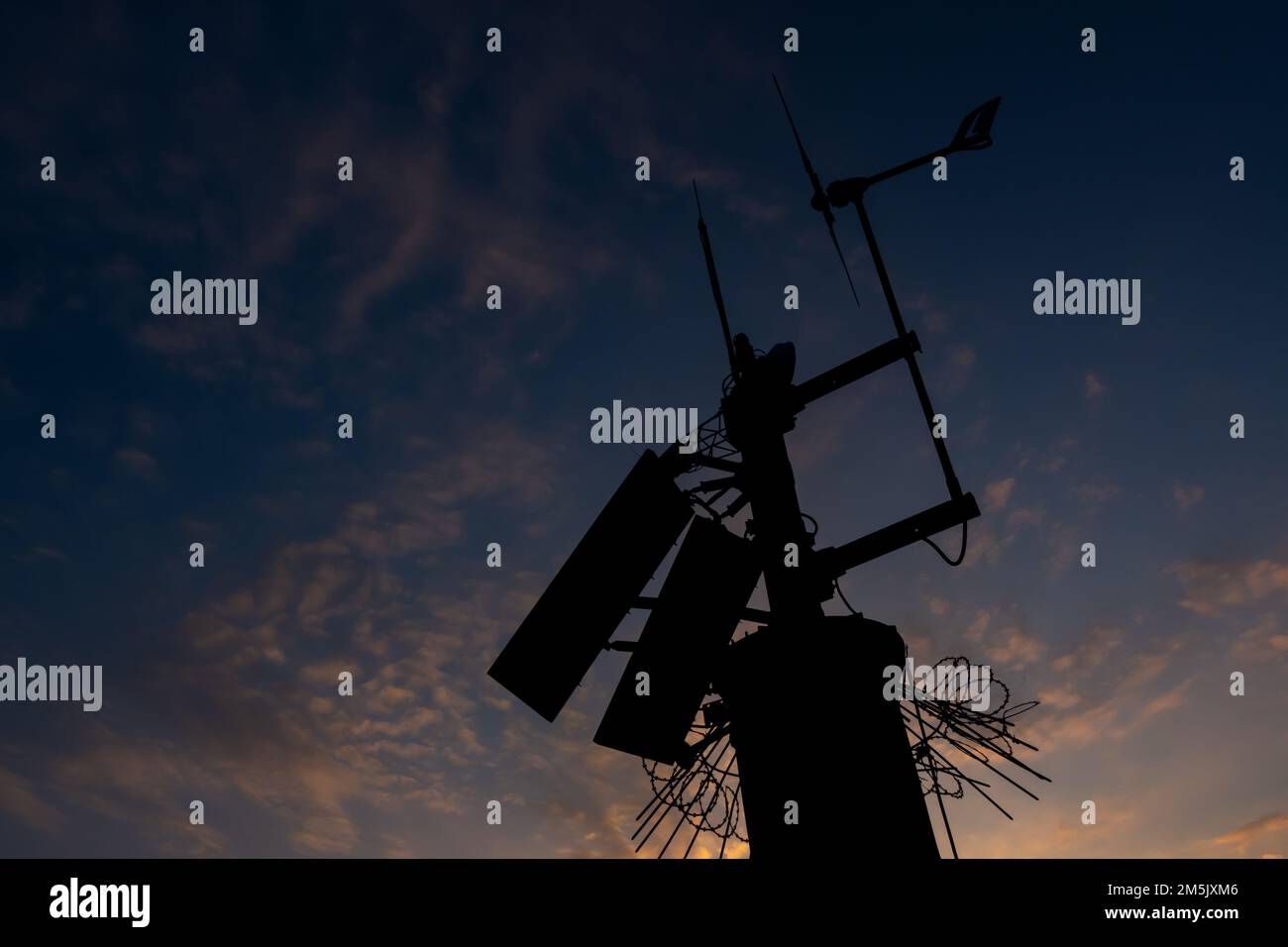 Meteo station against the setting sun. Elements of the continuous ... Meteo station against the setting sun. Elements of the continuous ...