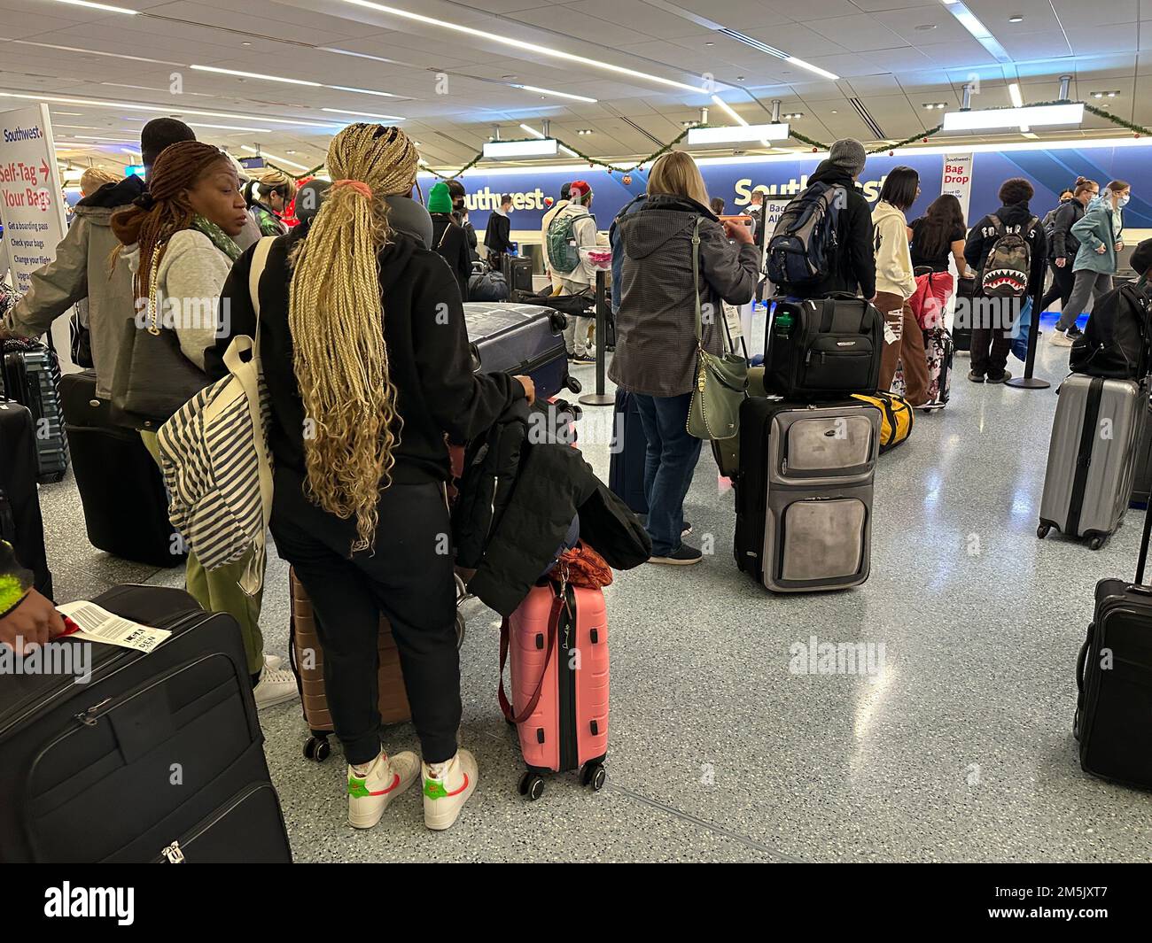 Passengers check in baggage at the Southwest Airlines ticket counter at ...