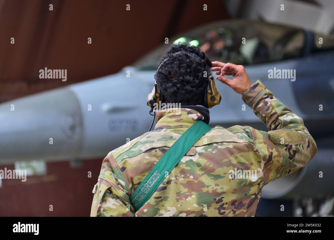 A U.S. Air Force F-16 Fighting Falcon crew chief assigned to the 555th ...
