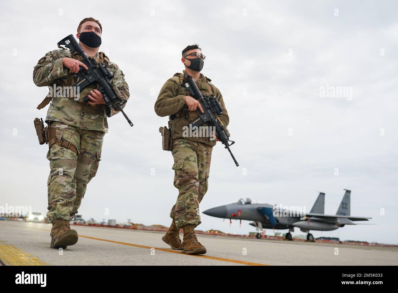 Two defenders assigned to the 18th Wing Security Forces Squadron patrol ...
