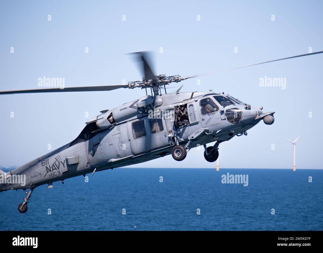An MH-60S Nighthawk helicopter, attached to the "Tridents" of ...