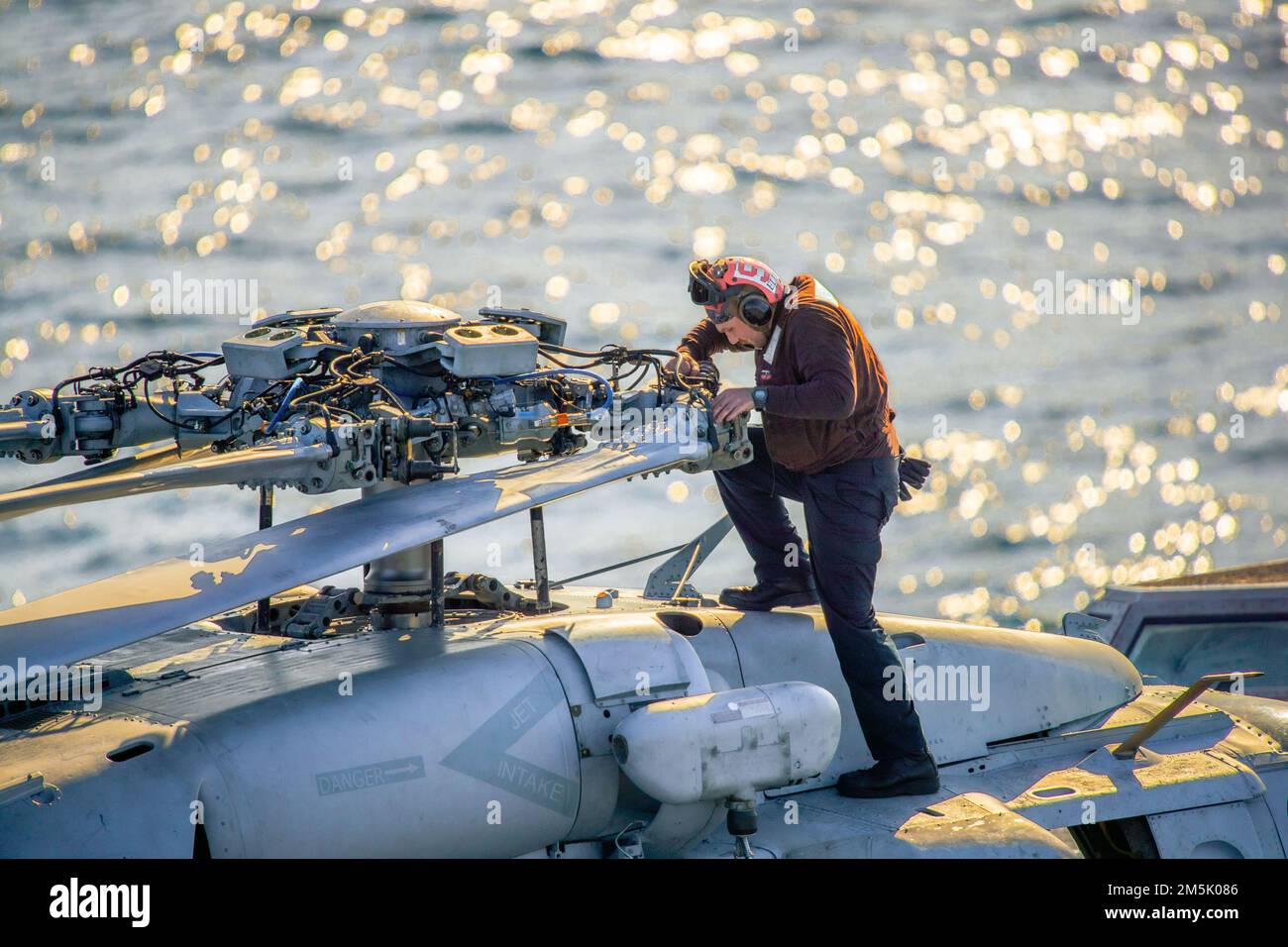 A Sailor assigned to “Tridents” of Helicopter Sea Combat Squadron (HSC ...