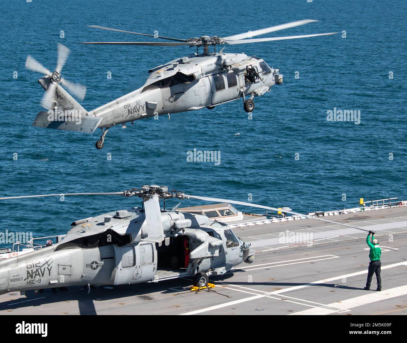 An MH-60S Nighthawk helicopter, attached to the "Tridents" of ...