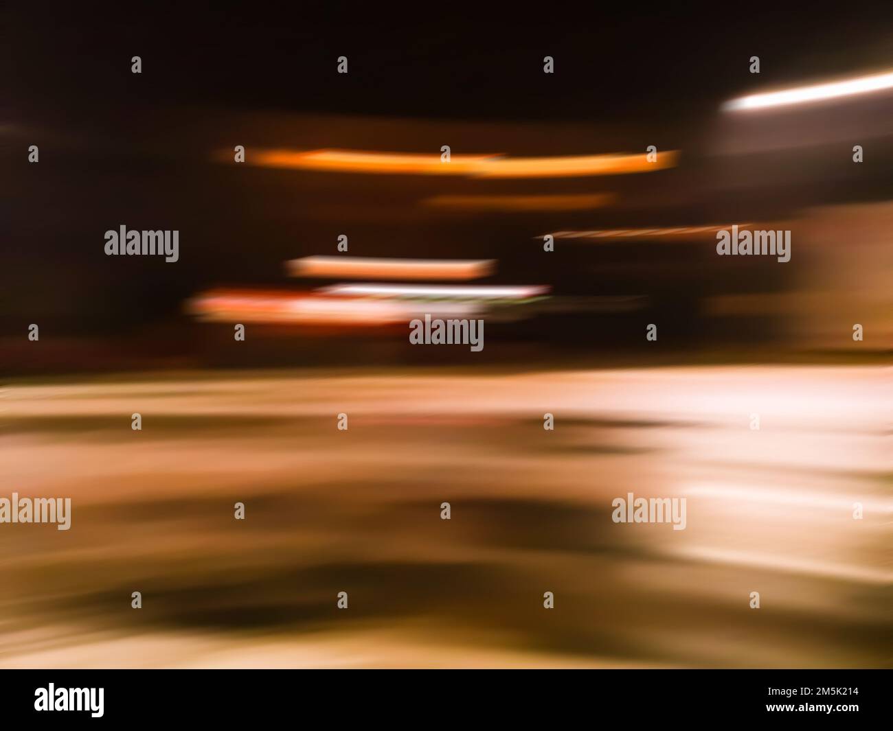 Blurred car driving fast in modern city night background. Defocused ...