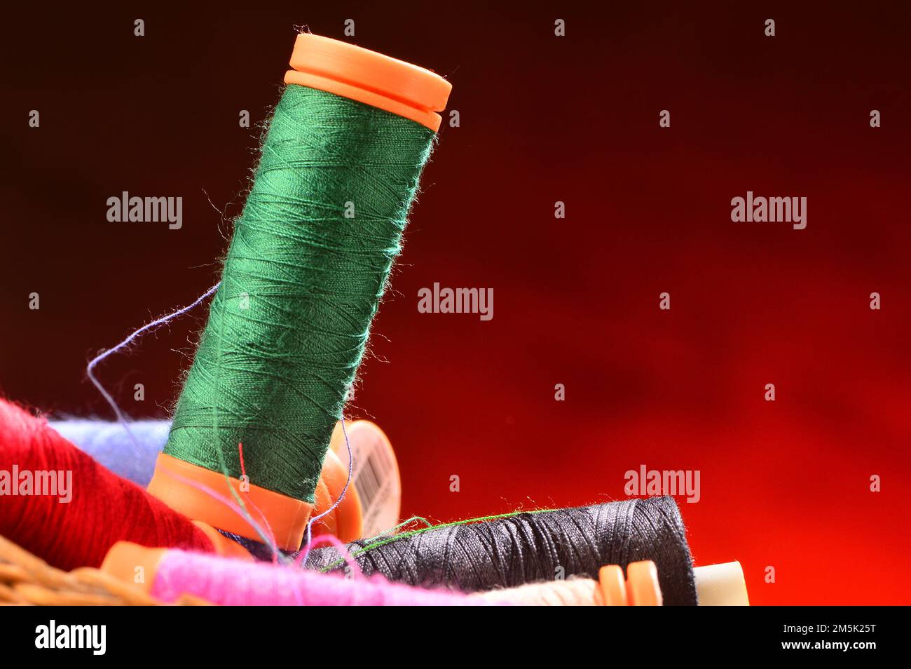 Sewing material with red background Stock Photo - Alamy