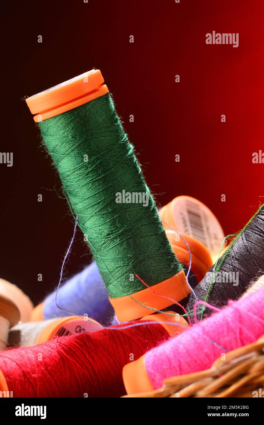 Sewing material with red background Stock Photo - Alamy
