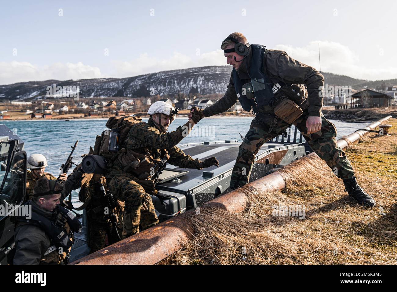 Korps Mariniers with the Royal Netherlands Marine Corps help a U.S ...