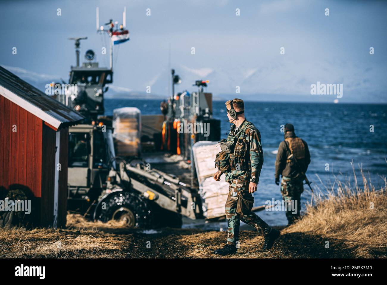 A Korps Marinier with the Royal Netherlands Marine Corps oversees the ...