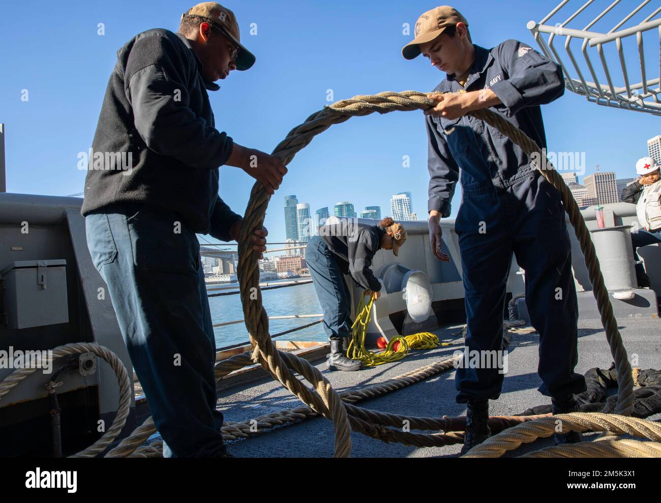 220322-N-XK047-1121 SAN FRANCISCO (March 22, 2022) – Sailors fake out a ...