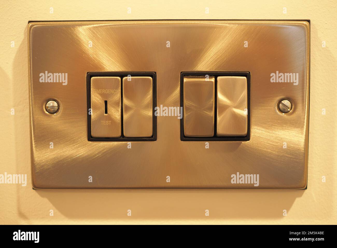 A closeup shot of the modern brushed chrome light switches Stock Photo ...