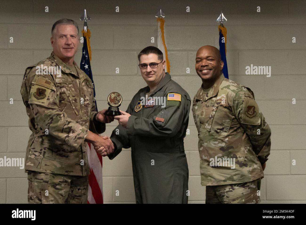 U.S. Air Force Brig. Gen. David Eaglin, 18th Wing commander, presents a ...
