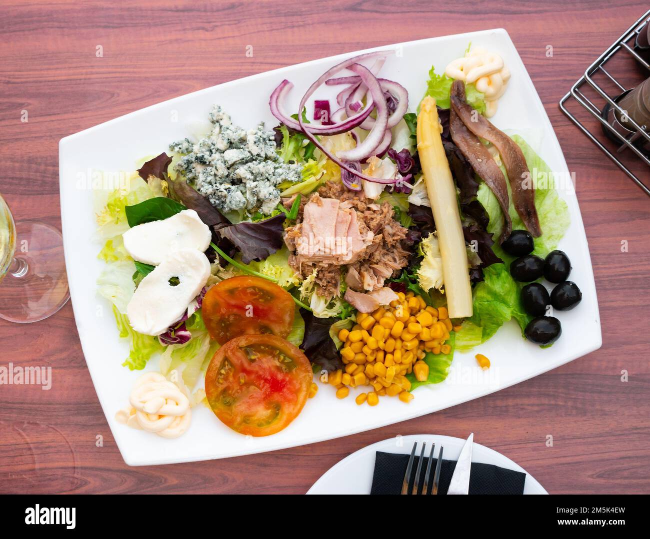 Fresh tuna salad with cheese served on table Stock Photo - Alamy