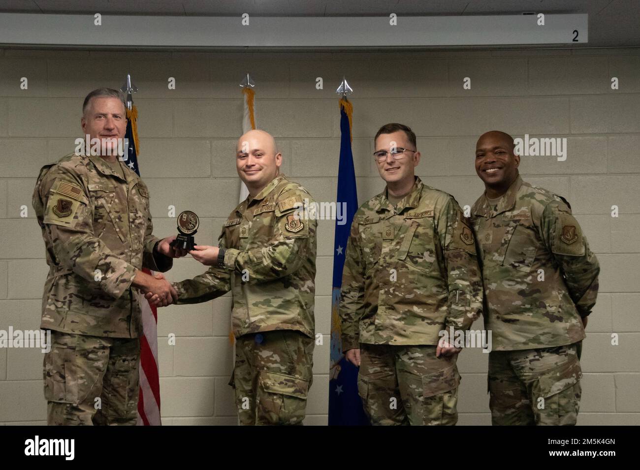 U.S. Air Force Brig. Gen. David Eaglin, 18th Wing commander, presents a ...