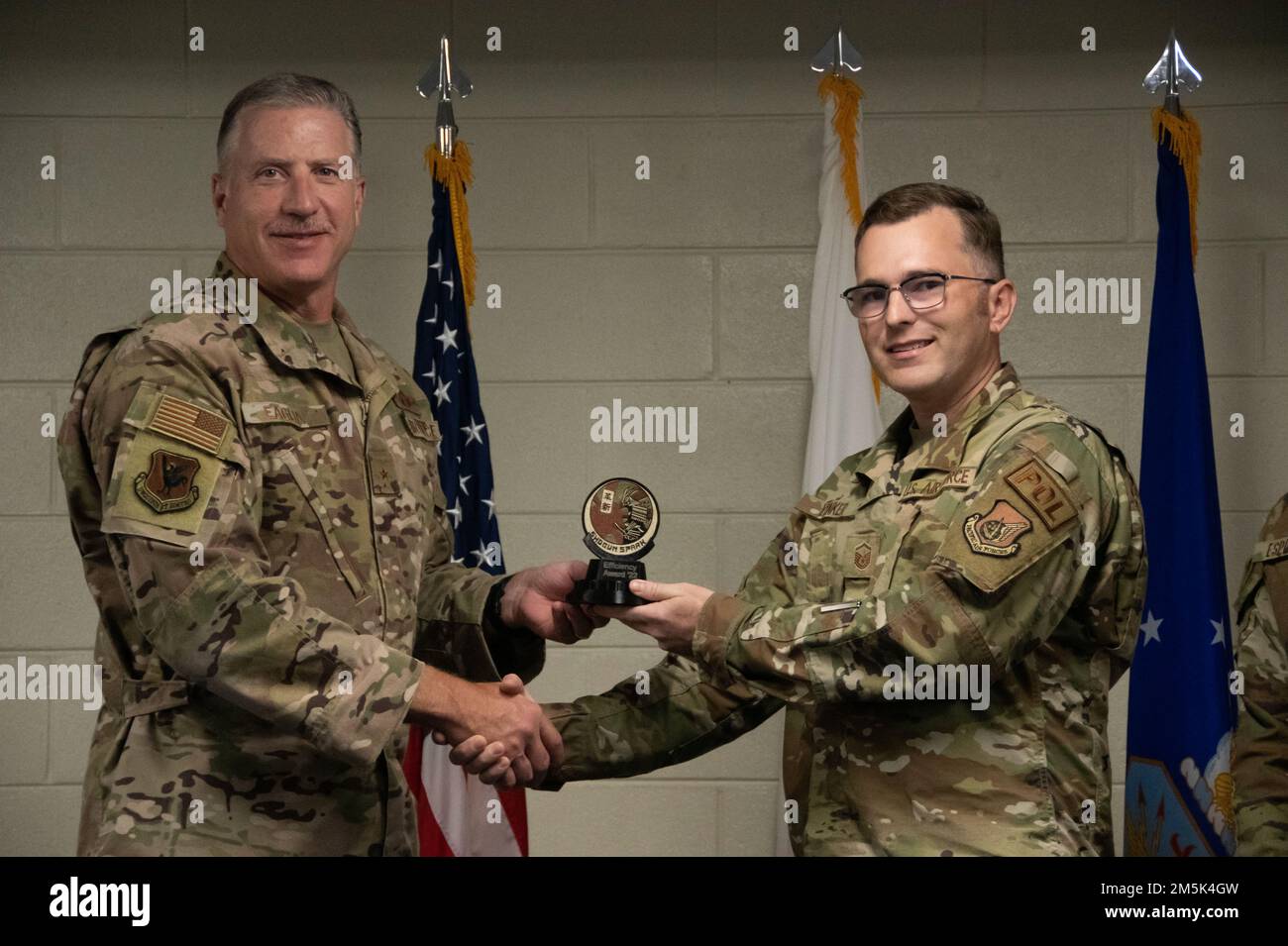 U.S. Air Force Brig. Gen. David Eaglin, 18th Wing commander, presents a ...