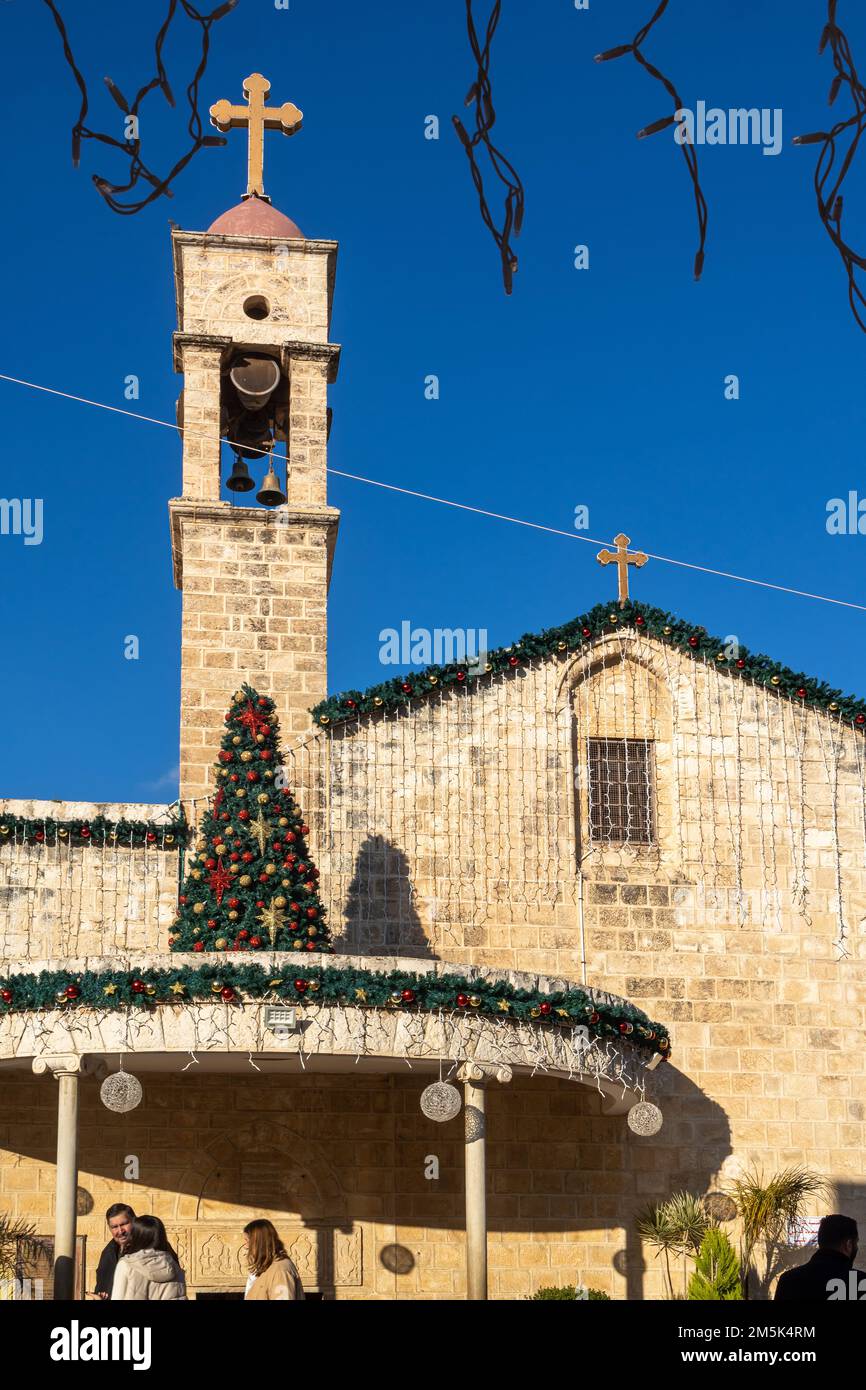NAZARETH, ISRAEL - DECEMBER 2022: People celebrate the Christmas, near ...