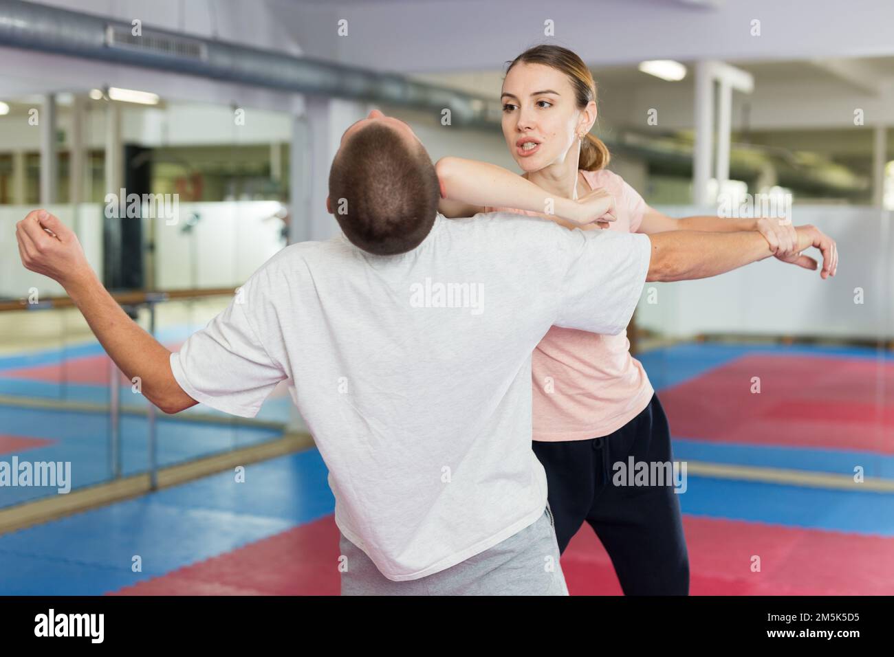 Woman performing elbow strike during self-defence training Stock Photo ...