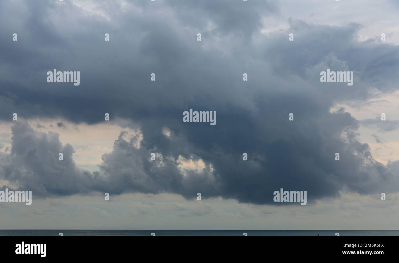 Dramatic dark cloudy sky over sea, natural photo background Stock Photo - Alamy