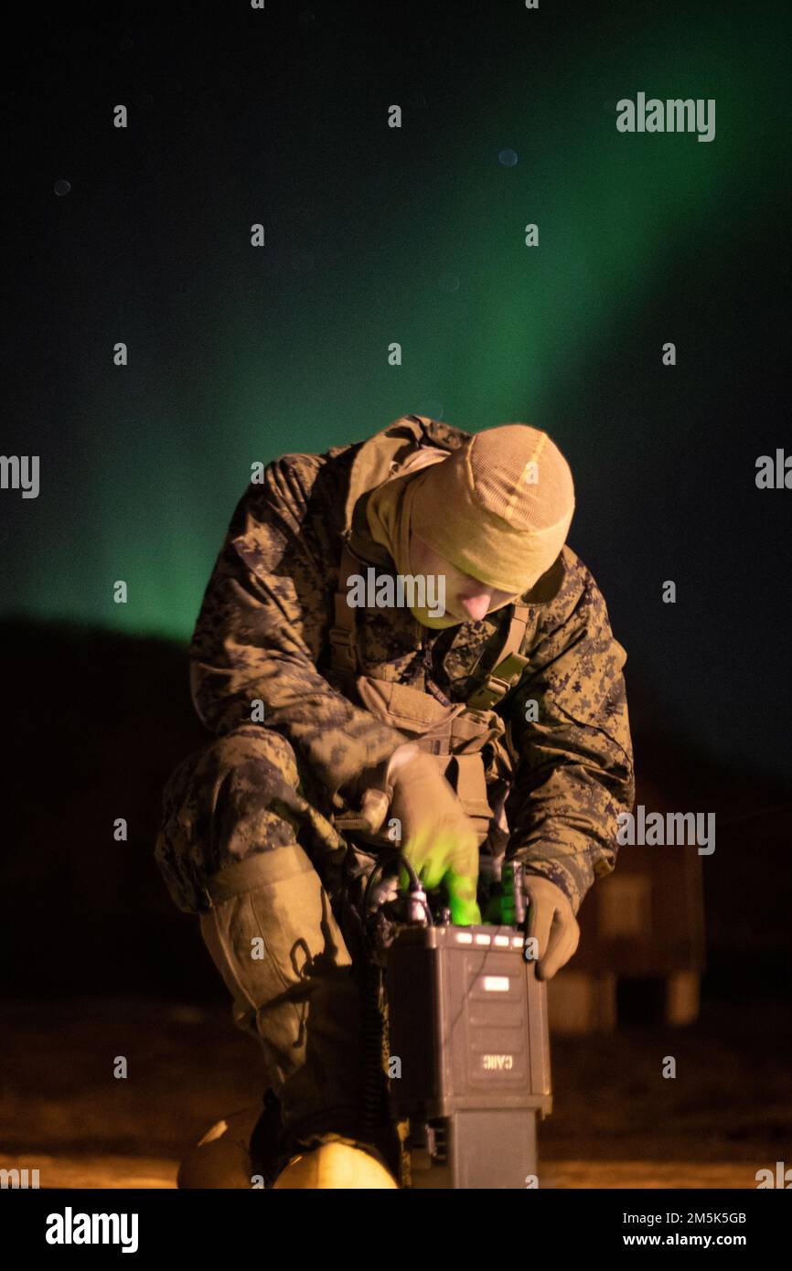 U.S. Marine Corps Lance Cpl. Tyson Franklin sets up communication ...