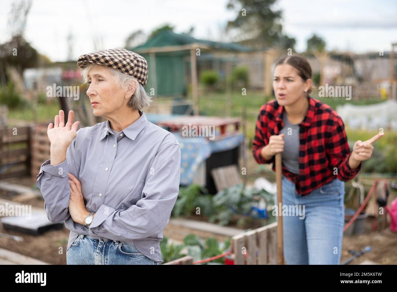 Conflict between female neighbors in country farm Stock Photo - Alamy