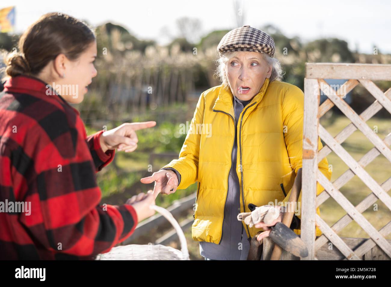 Conflict between female neighbors in country farm Stock Photo - Alamy