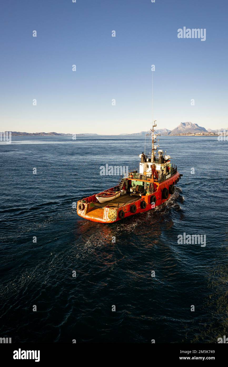 Tug and pilot vessel Masik Viking leading a ship into the port of Nuuk ...
