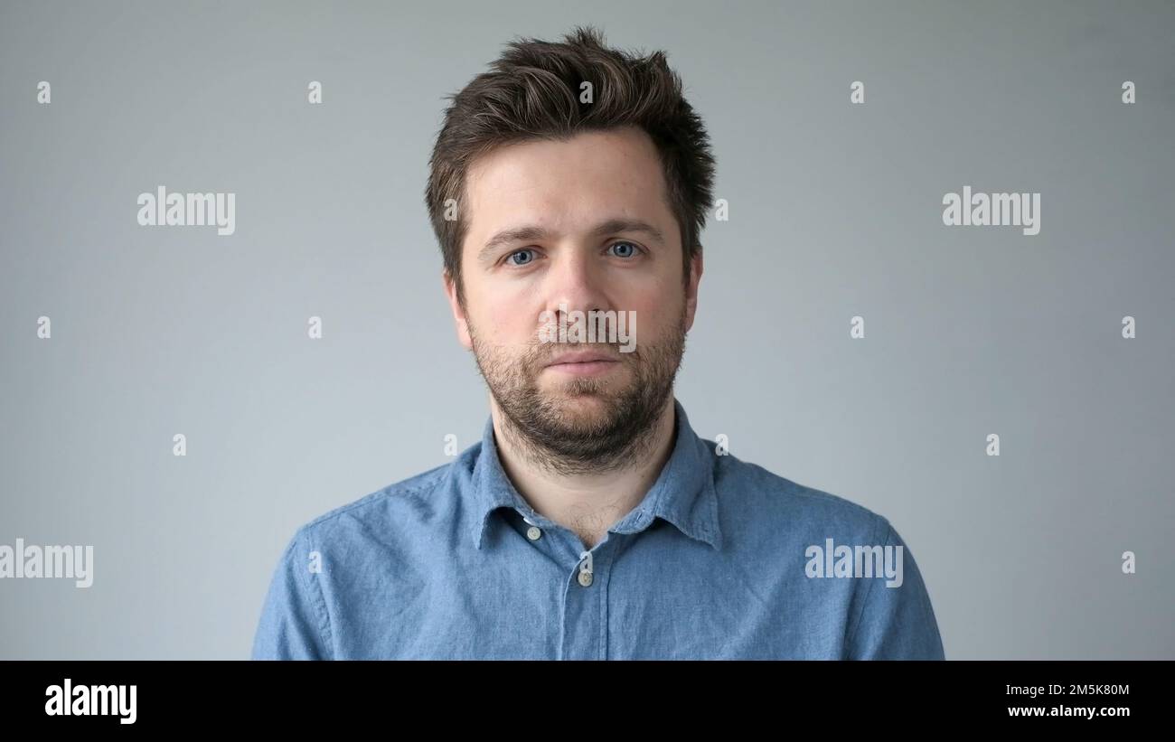 Serious young man worker hi-res stock photography and images - Alamy