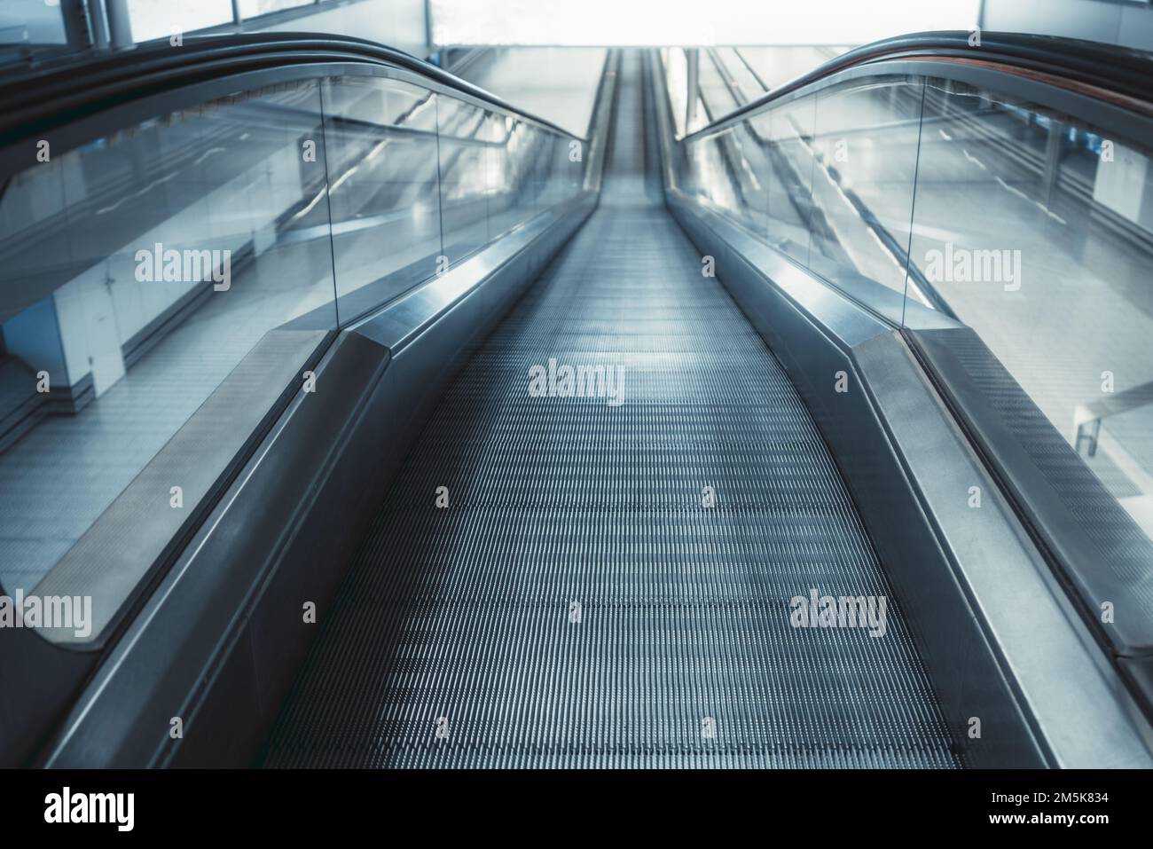 Selective focus on the foreground with a long empty descending moving ...