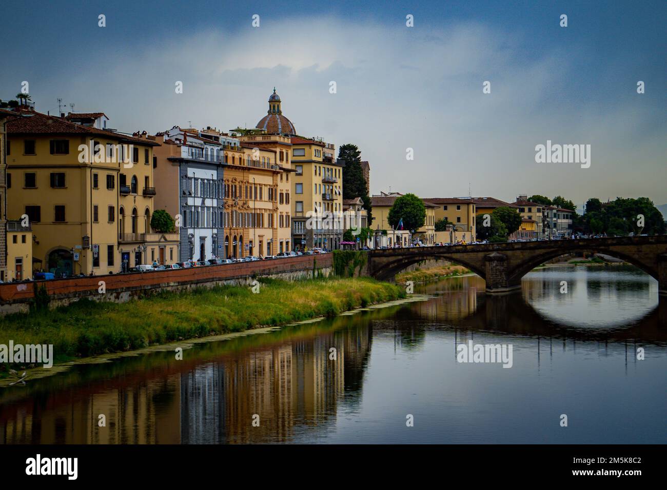 A horizontal view of Ponte Santa Trinita bridge over the Arno River on ...