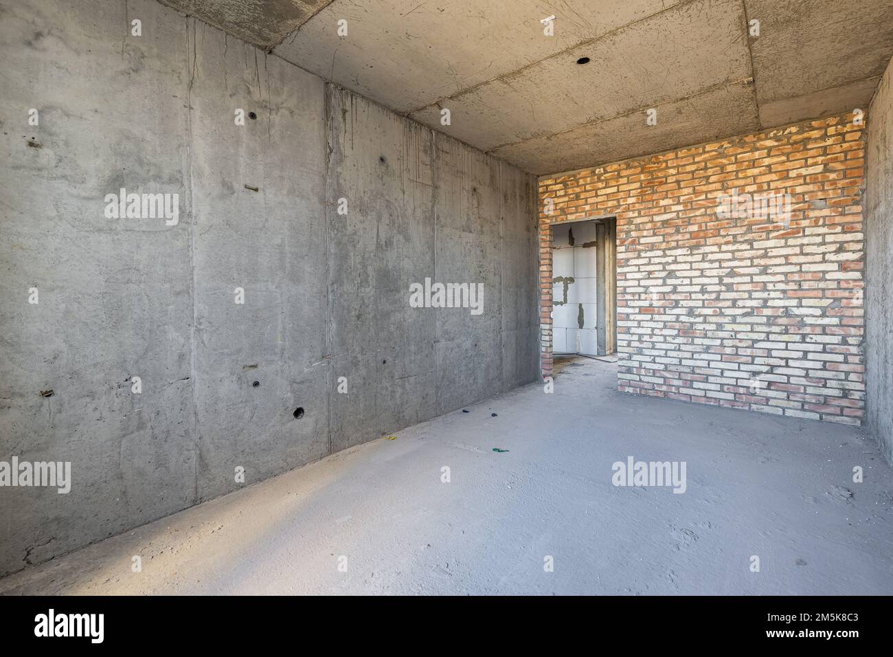 Empty concrete commercial space without finishing with partitions Stock ...