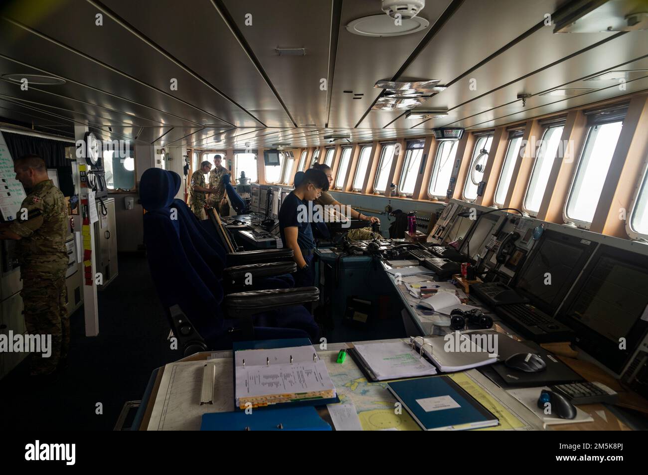 Sailors standing watch on the bridge of the Royal Danish Navy patrol ...