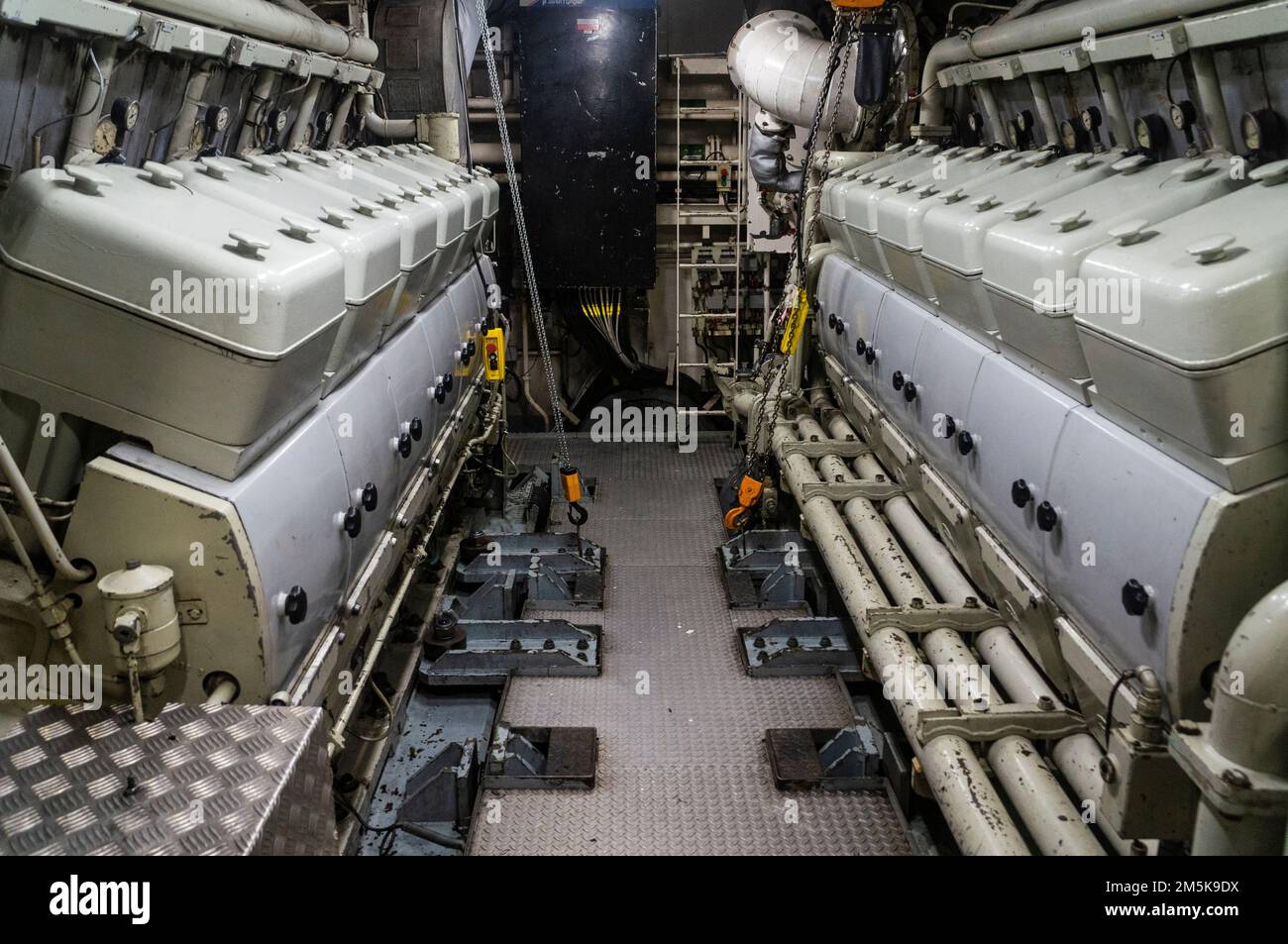 Twin diesels in the engine room of the Royal Danish Navy's patrol ship ...