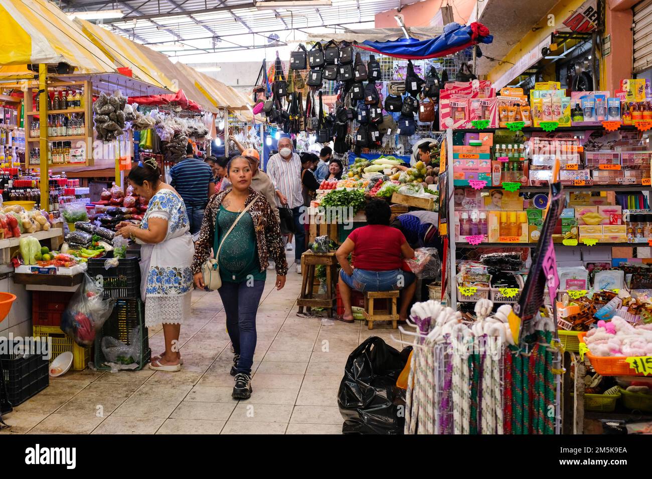 Woman walking at the Lucas de Galvez Market in the center of Merida ...