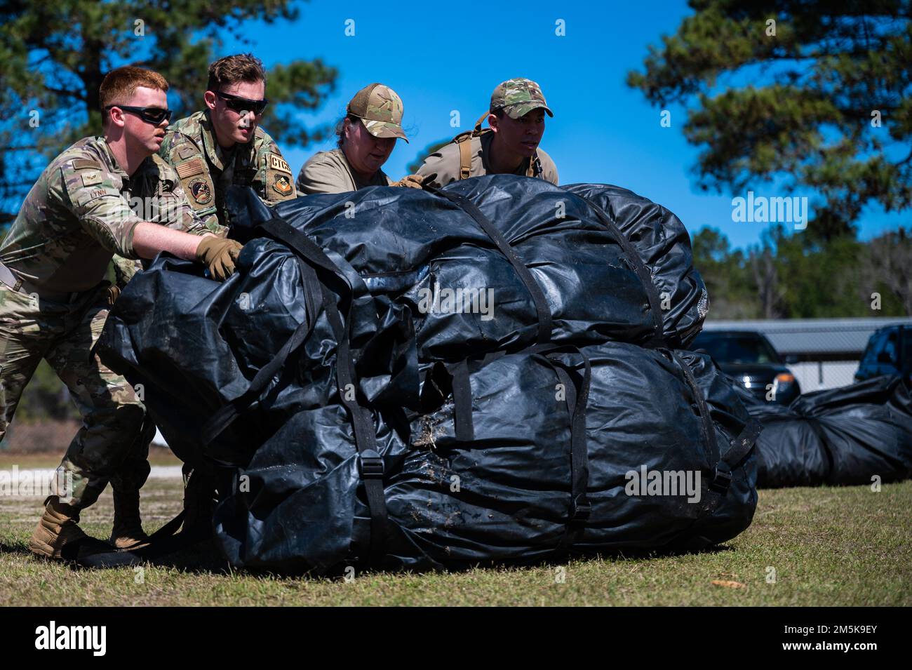 U.S. Air Force Airmen prepare a tent used for a simulated joint ...