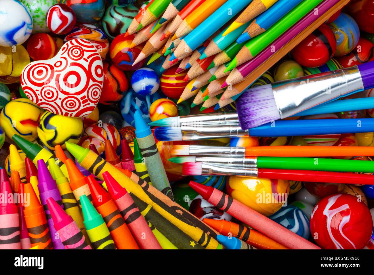 Heart With Crayons And Pencils, Artist Brushes Marbles Still Life Stock ...