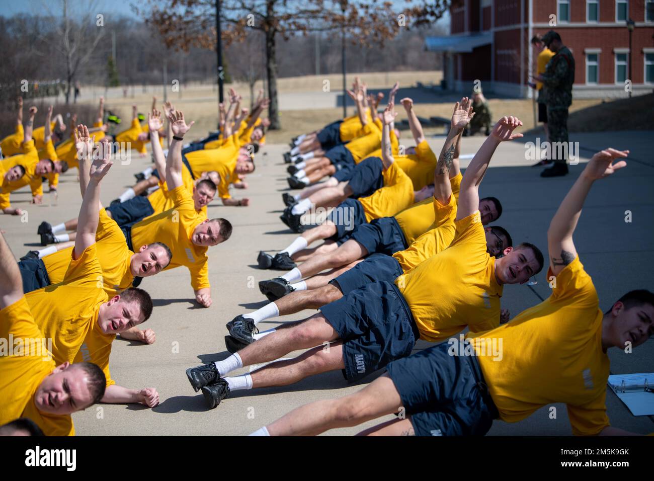 Recruits perform a physical training session outside at Recruit ...