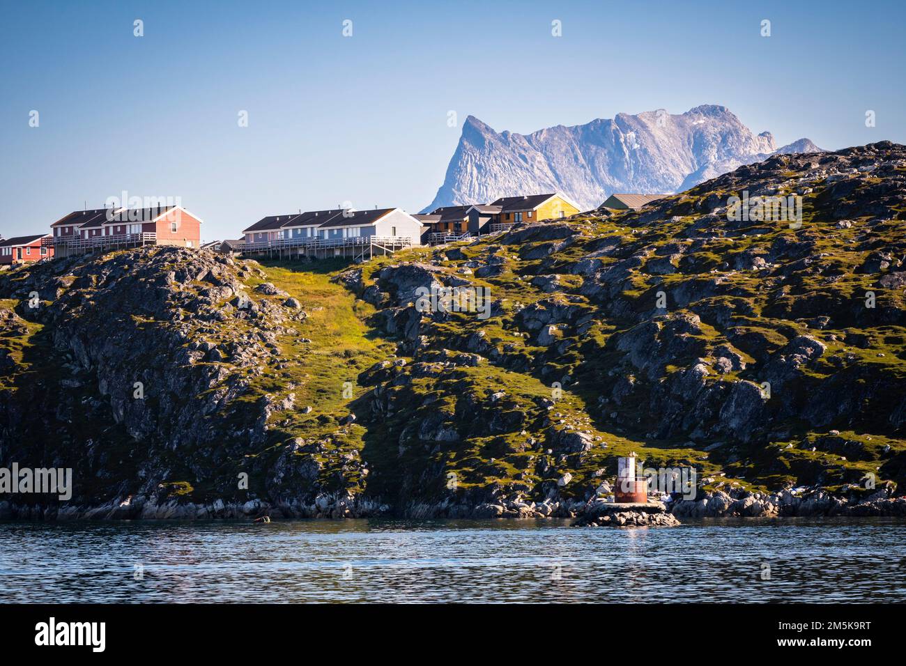 Residential buildings on top of a cliff in Nuuk, which is located on ...
