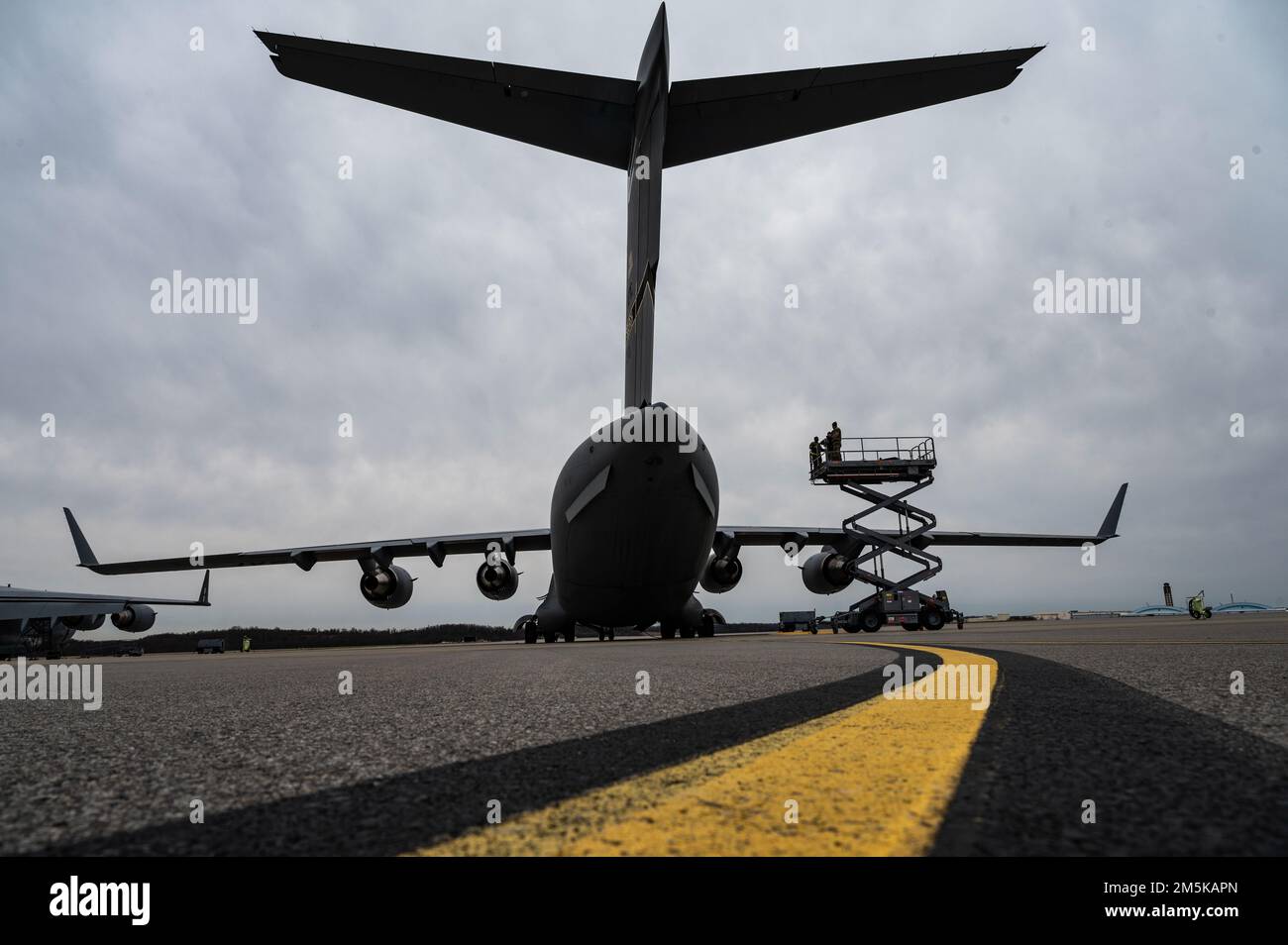 Airmen assigned to the 911th Aircraft Maintenance Squadron inspect the ...