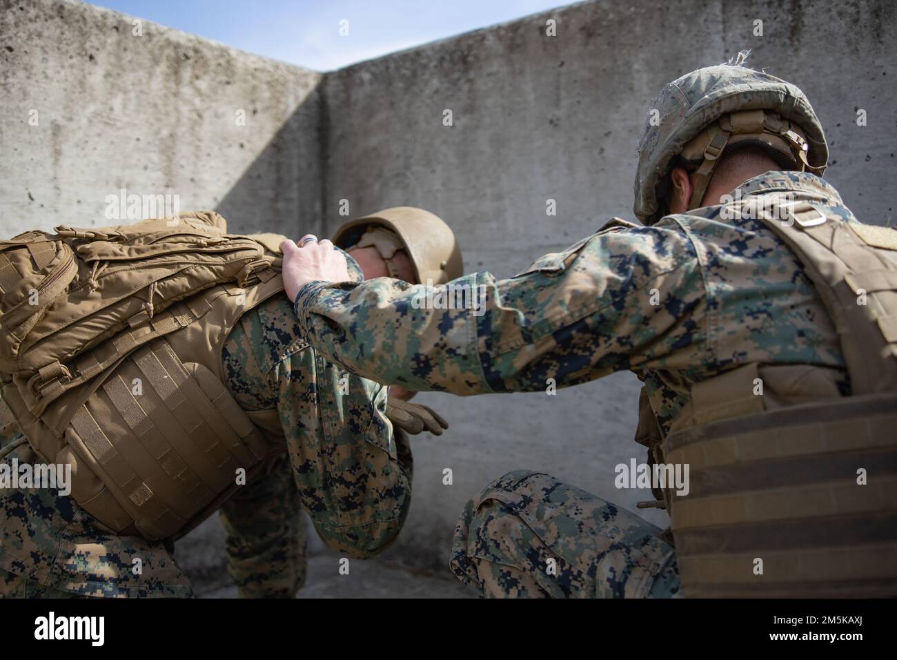 U.S. Marine Corps Cpl. Kenneth Marion, right, a motor transport ...