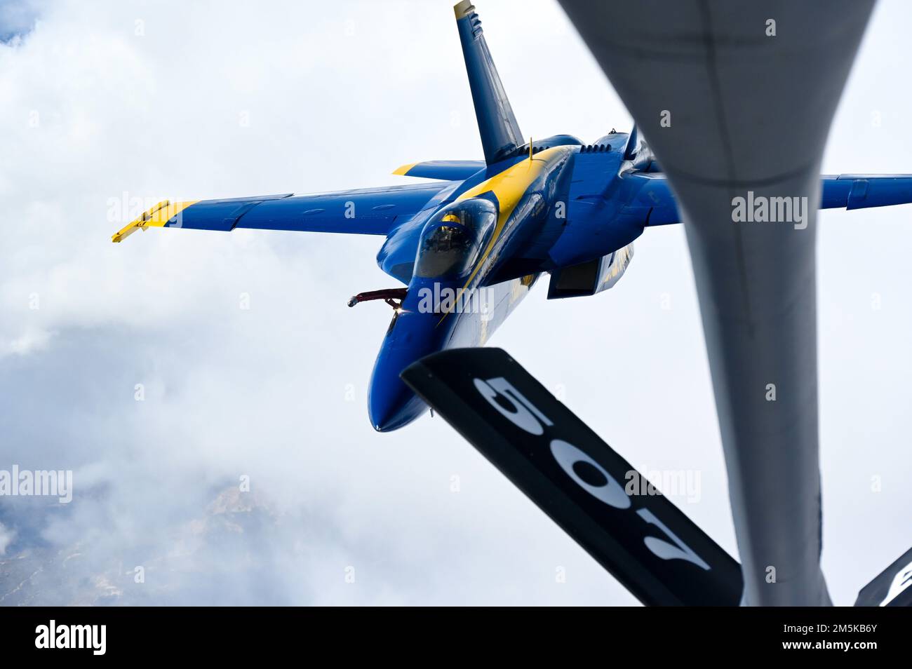 A U.S. Navy Blue Angel F/A-18E Super Hornet prepares to receive fuel ...