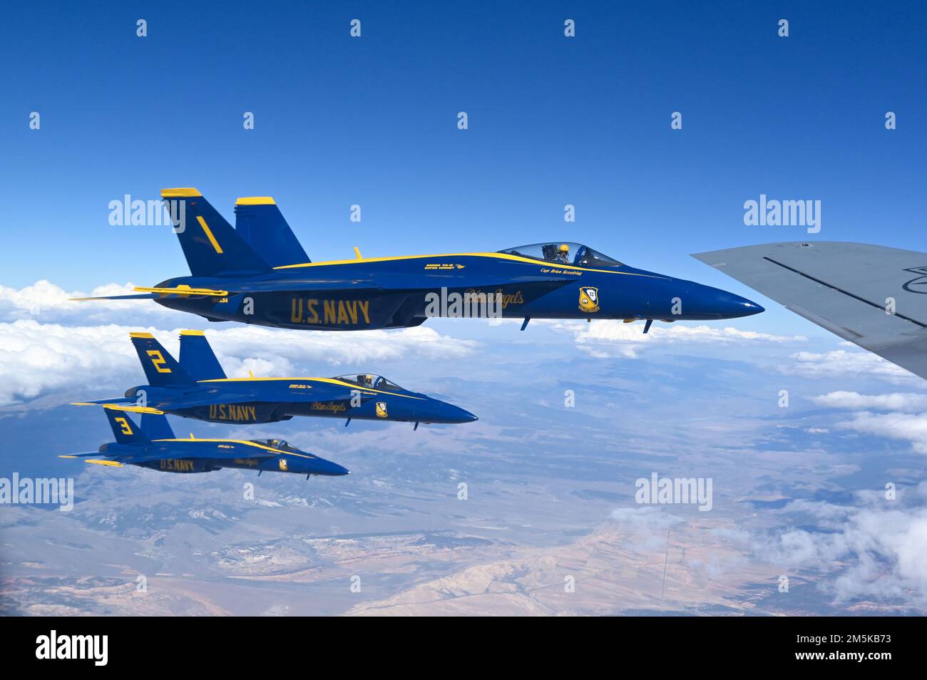 Three U.S. Navy Blue Angel F/A-18E Super Hornets fly alongside a KC ...