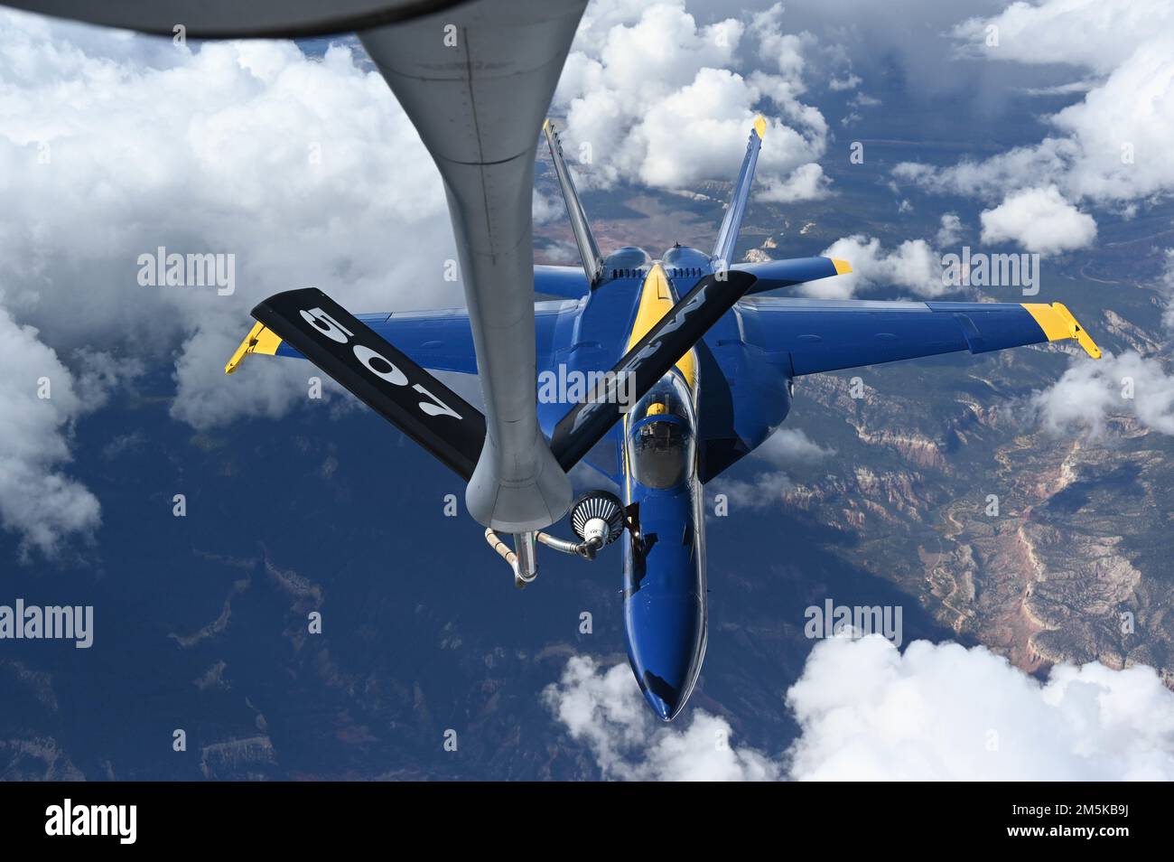 A U.S. Navy Blue Angel F/A-18E Super Hornet receives fuel from the ...