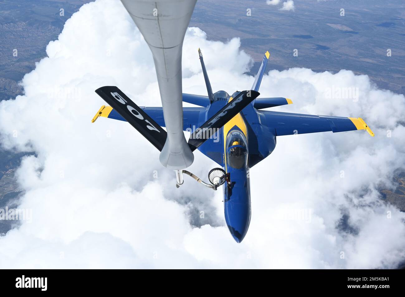 A U.S. Navy Blue Angel F/A-18E Super Hornet receives fuel from the ...