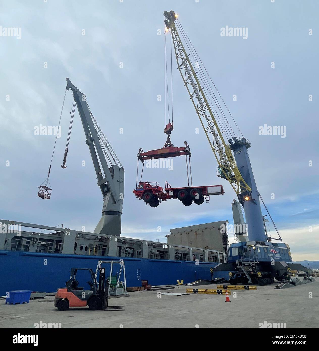 A vehicle is loaded onto the Military Sealift Command chartered ship MV ...