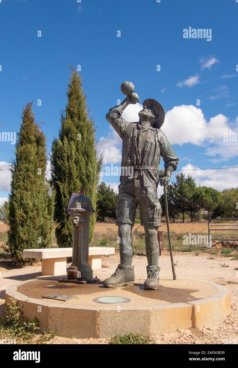 For the thirsty pilgrim. A public fountain with a statue of a drinking ...
