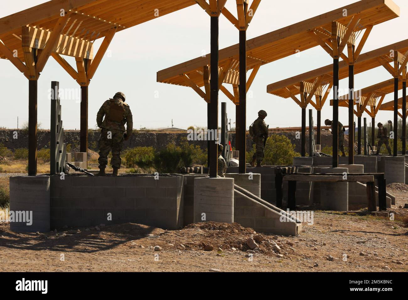 Competitors prepare to fire during the M4 qualification event at ...