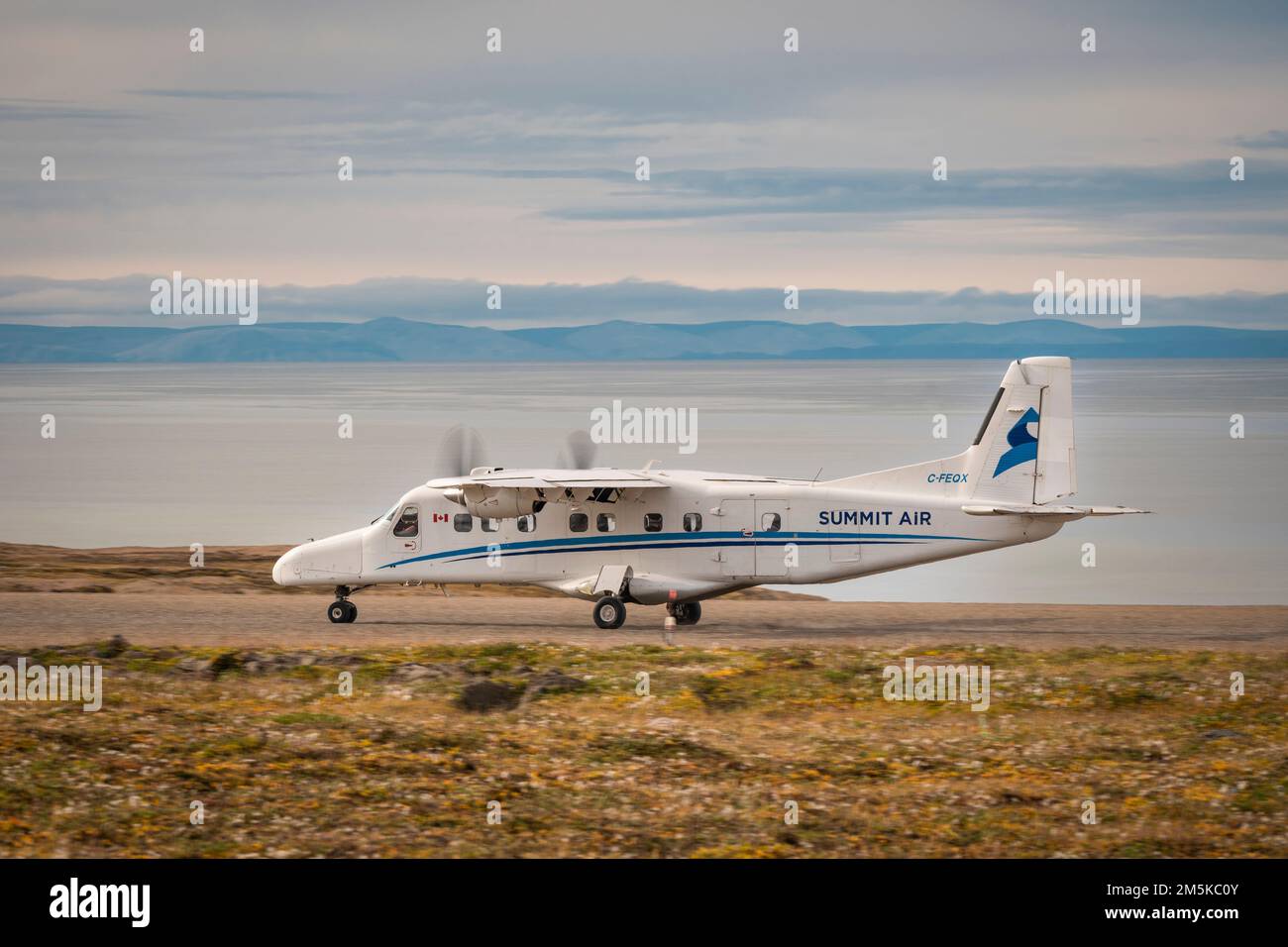 Dornier 228 airplane of Summit Air on the ground at Pond Inlet on ...