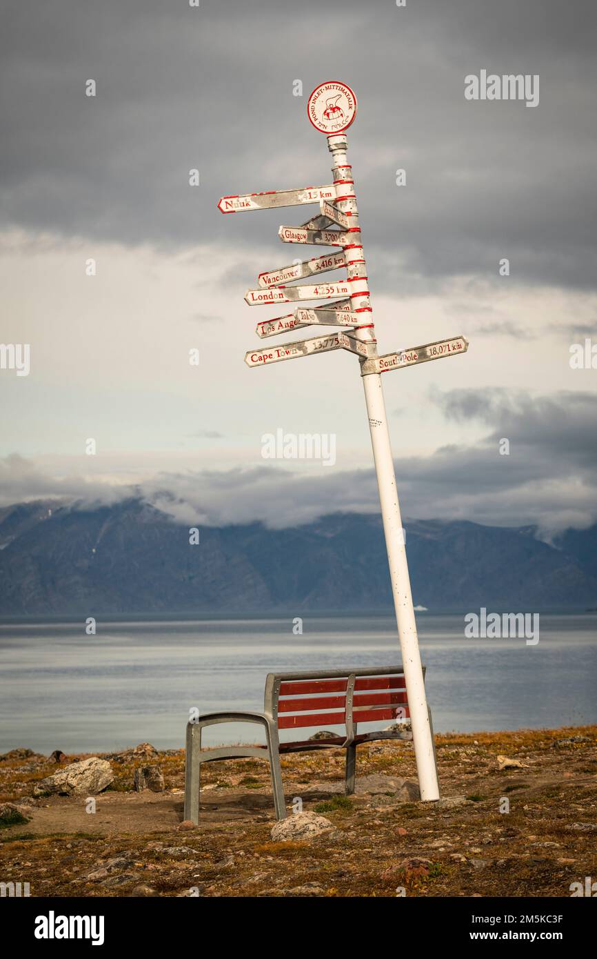 Park bench and distance sign at a viewpoint in Pond Inlet overlooking ...